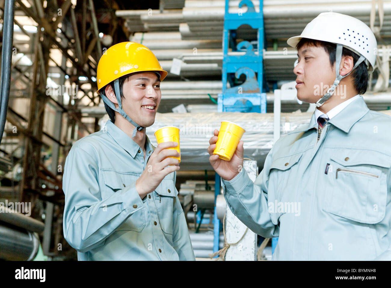 Warehouse Workers Having Coffee Break Stock Photo - Alamy