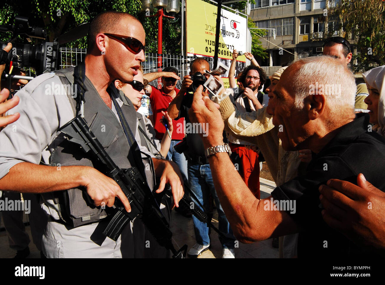 Leftists stage 'Tel Aviv checkpoint' An actor with a plastic machine ...