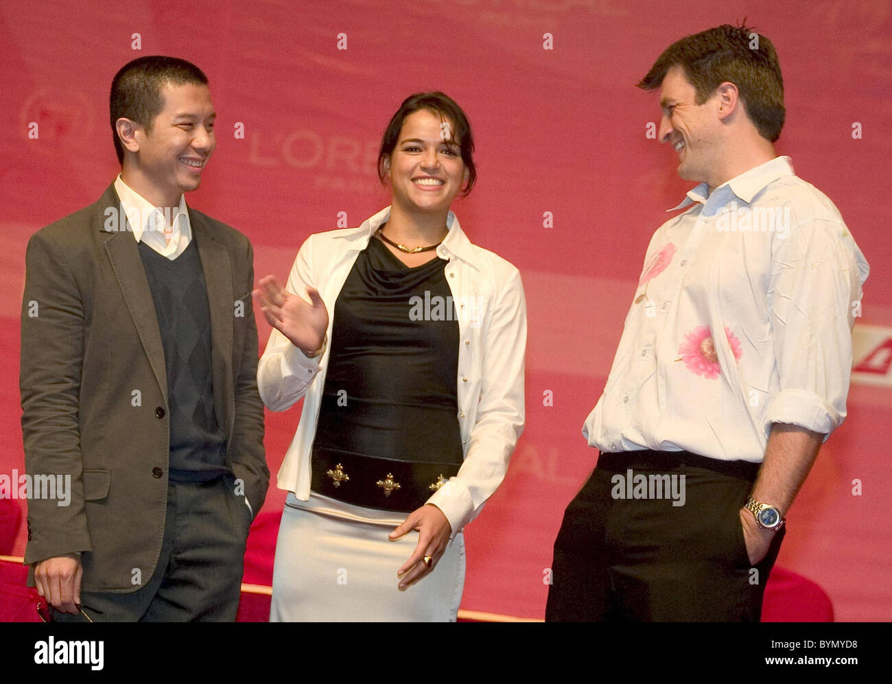 Reggie Lee, Michelle Rodriguez, Nathan Fillion attends at a press ...
