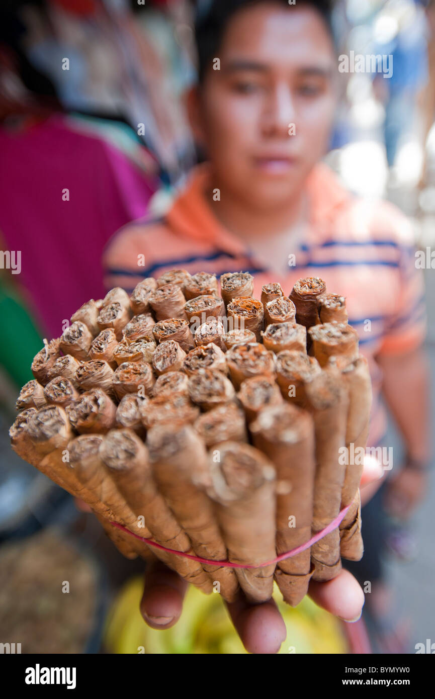 Young man selling cigars at the market in Copan Ruinas, Honduras ...