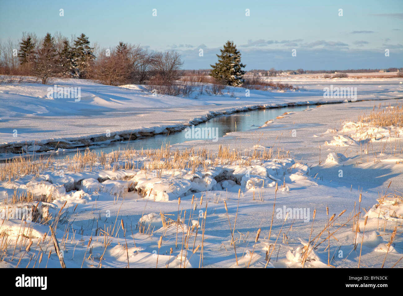 A small river or stream flowing through rural Prince Edward Island ...