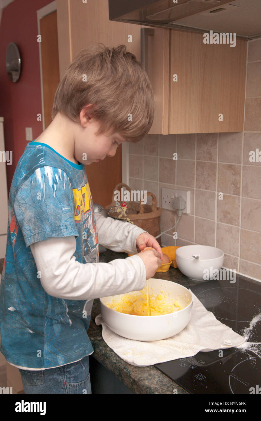 Child cracking egg hi-res stock photography and images - Alamy