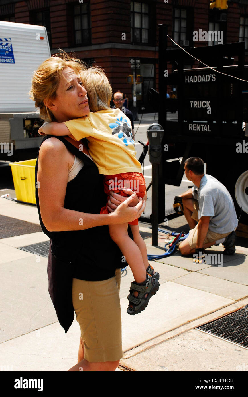 Edie Falco takes a walk in the sunshine with her son Anderson Falco ...