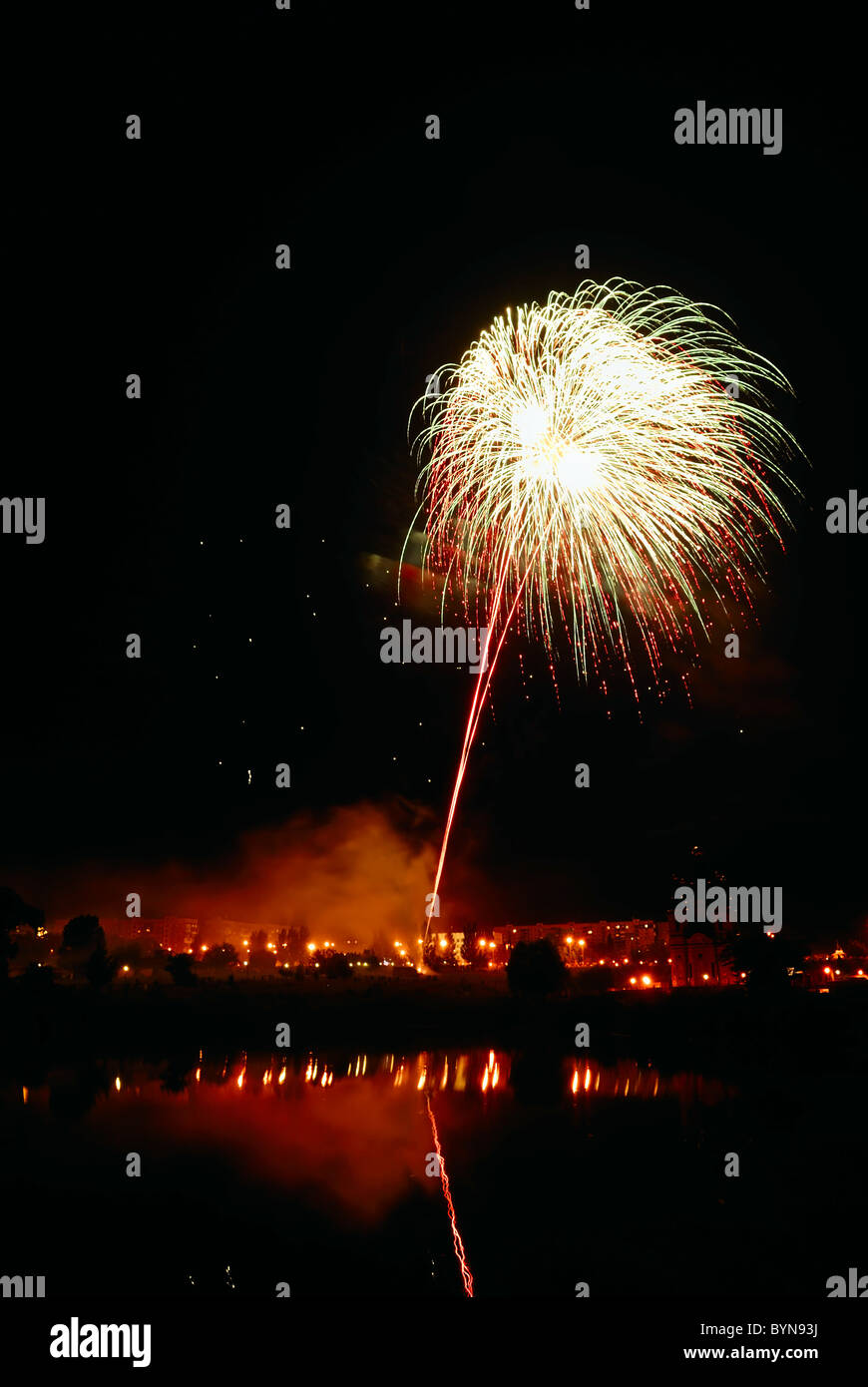 night traditional firework with reflection in water Stock Photo - Alamy