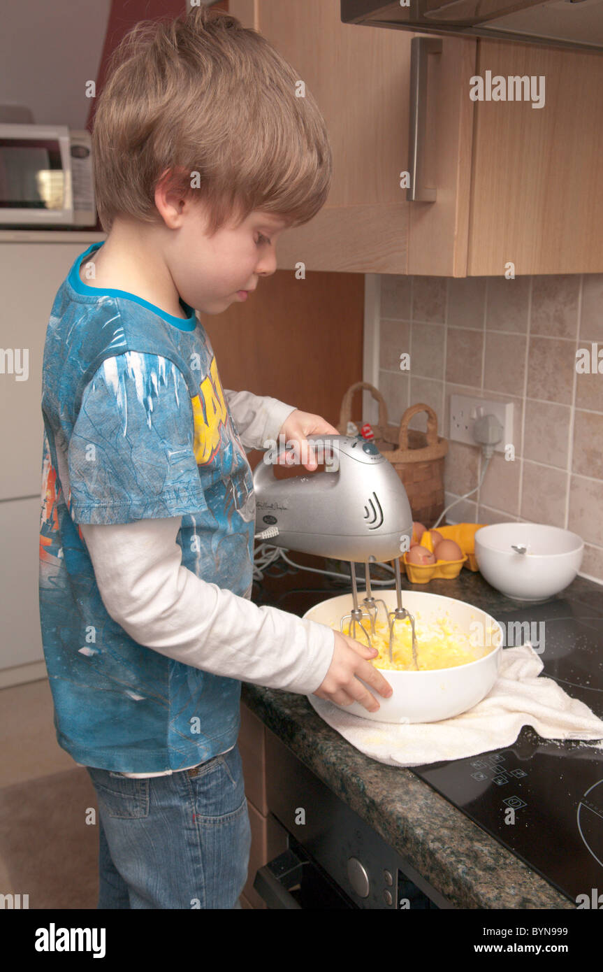 child boy using food mixer making a cake. Four year old Stock Photo - Alamy