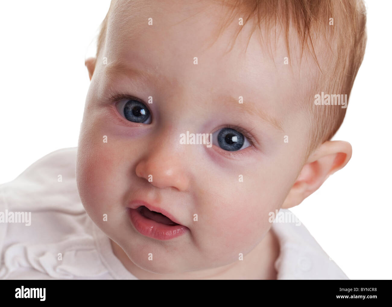 beautiful baby looking at the camera, isolated against a white ...
