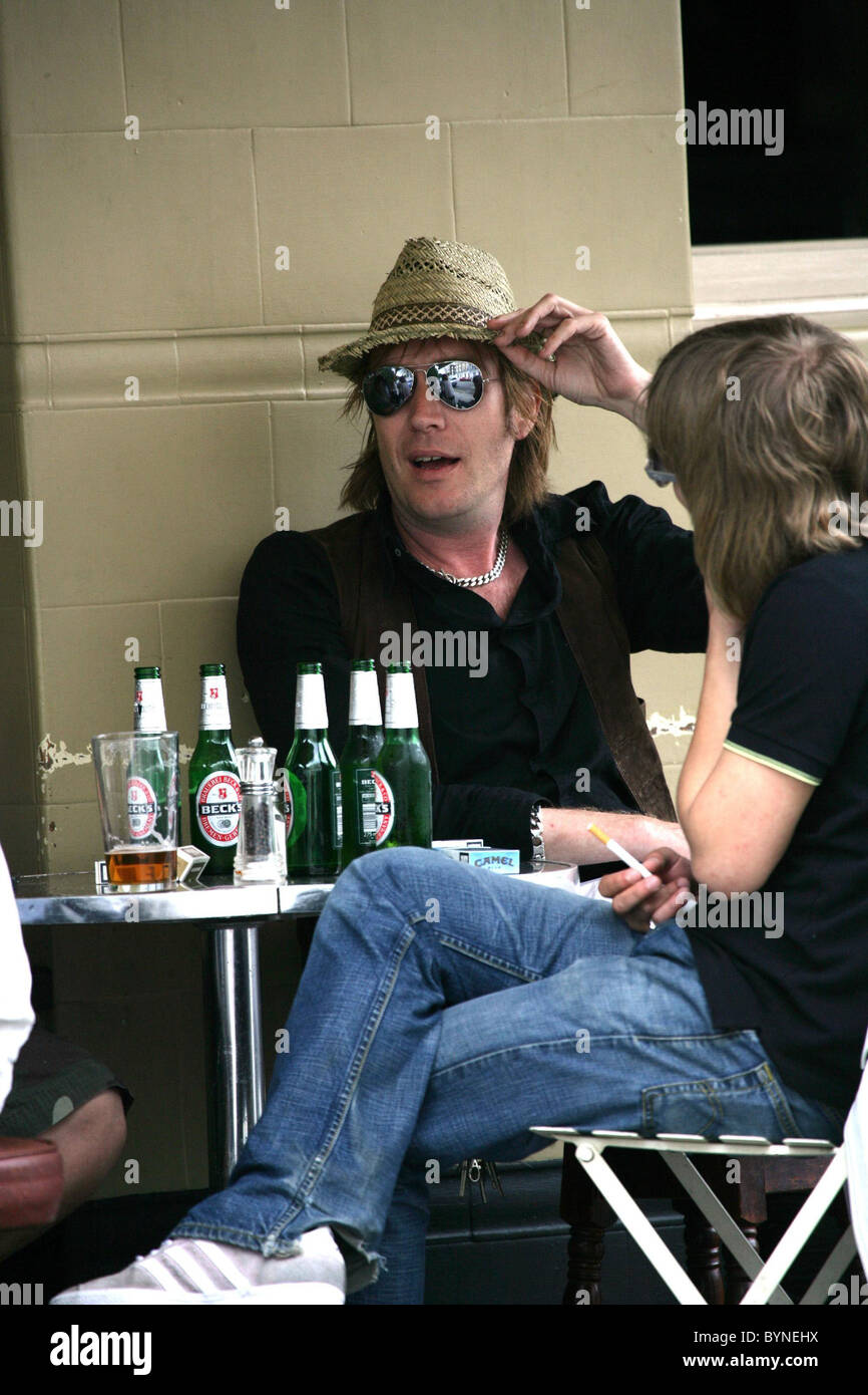 Rhys Ifans and a friend have a drink together in Primrose Hill London ...