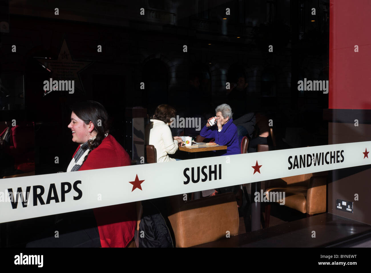 Lunchtime diners eat inside a Pret-a-Manger restaurant with strong ...