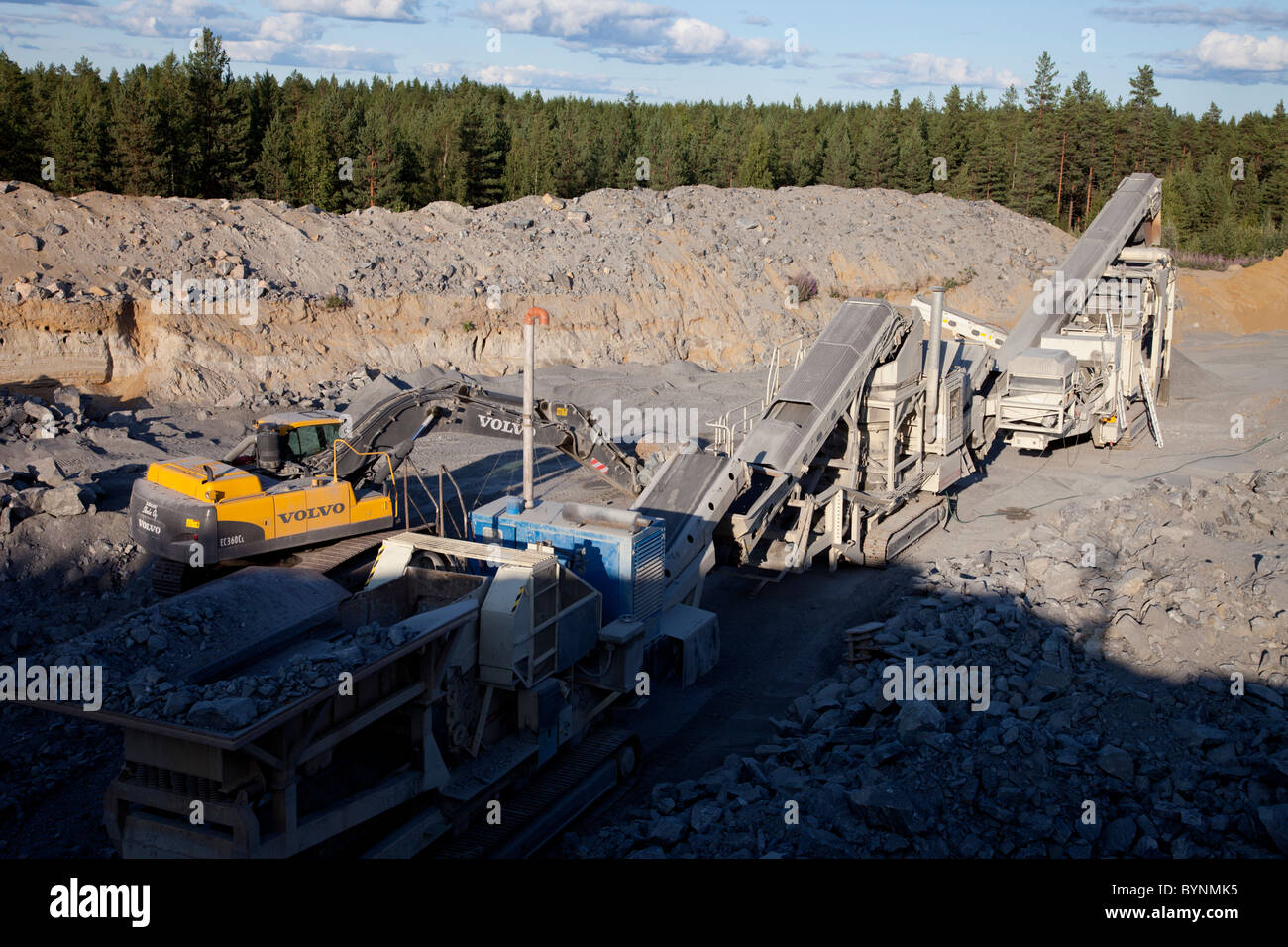 Rock crushing equipment and conveyor belt system at the bottom of a ...