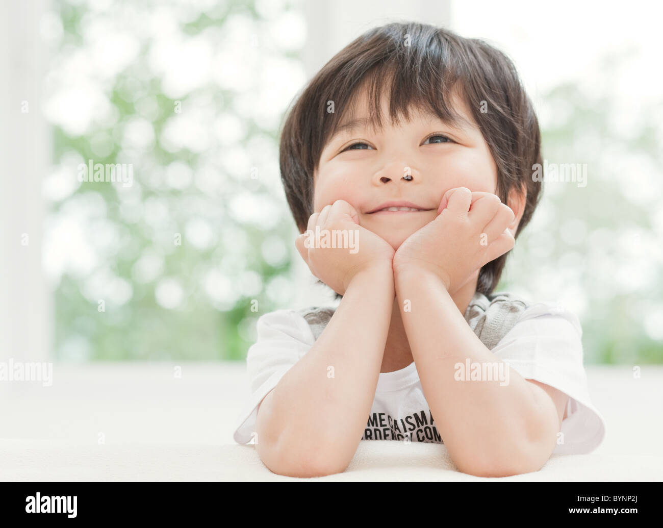 Boy Hand On Chin Smiling Contemplation Thinking Stock Photo - Alamy