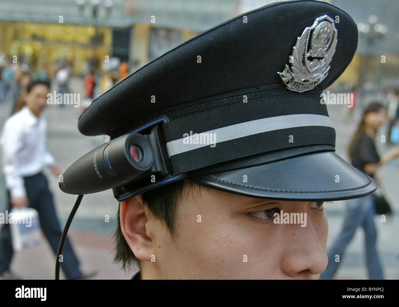 * POLICE CAMERA ACTION Chinese police get snap happy as they take their ...