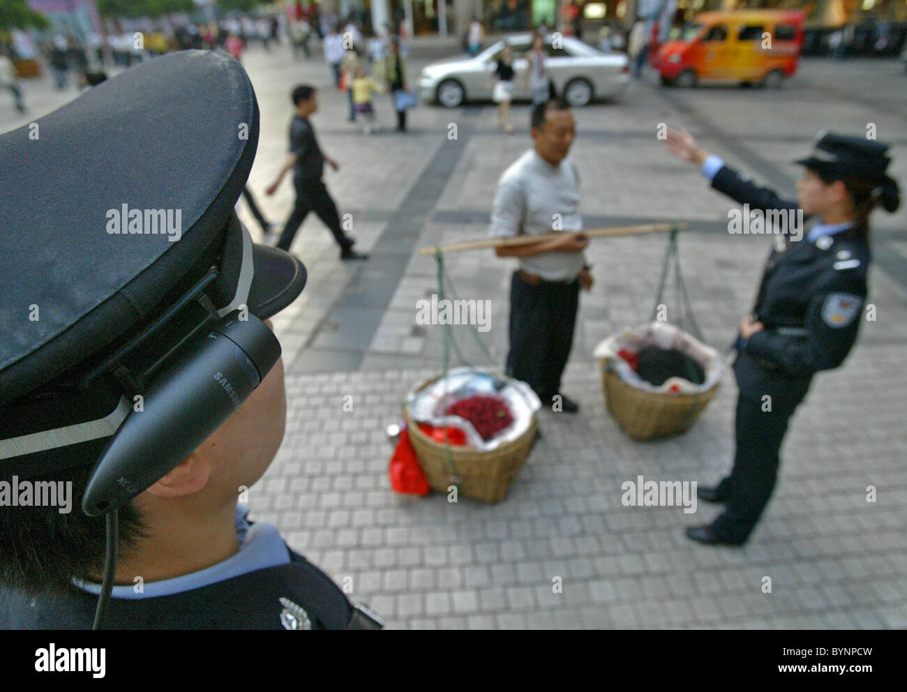 * POLICE CAMERA ACTION Chinese police get snap happy as they take their ...