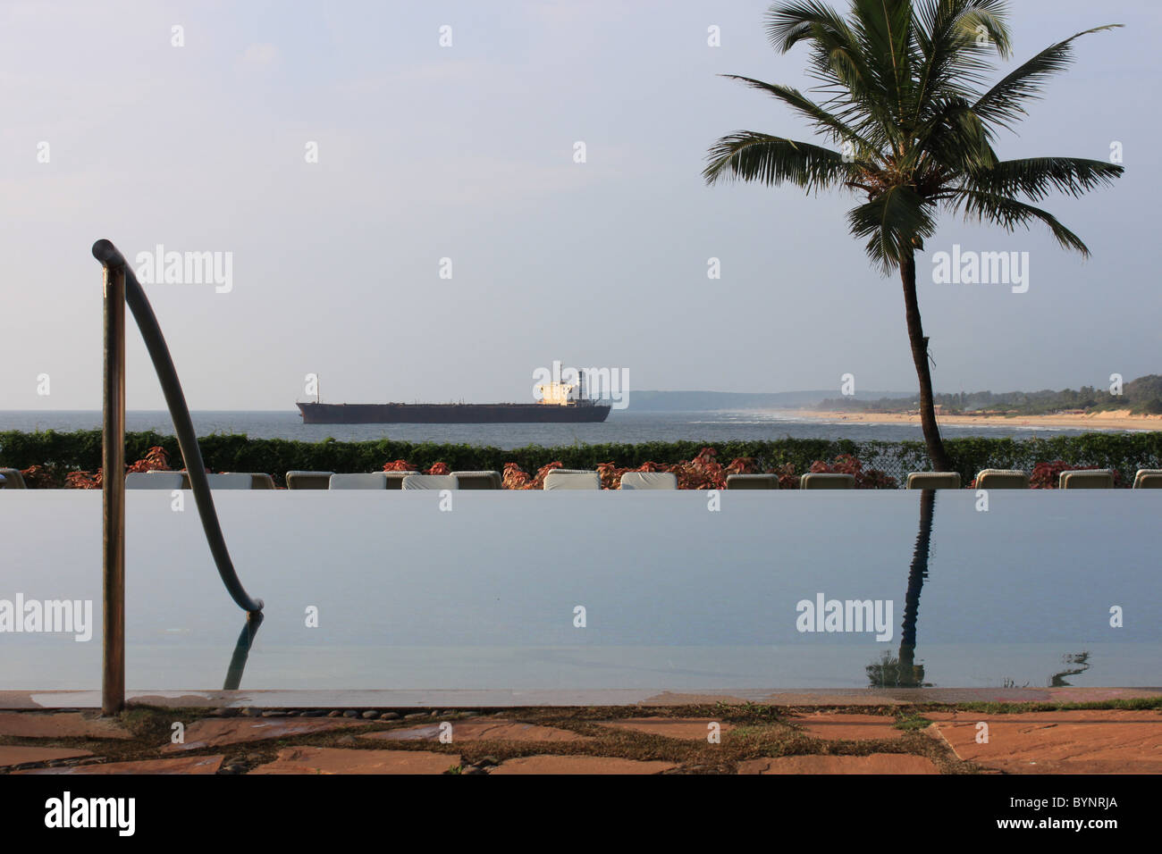 Sea sky pool with lone coconut tree ship hi-res stock photography and ...