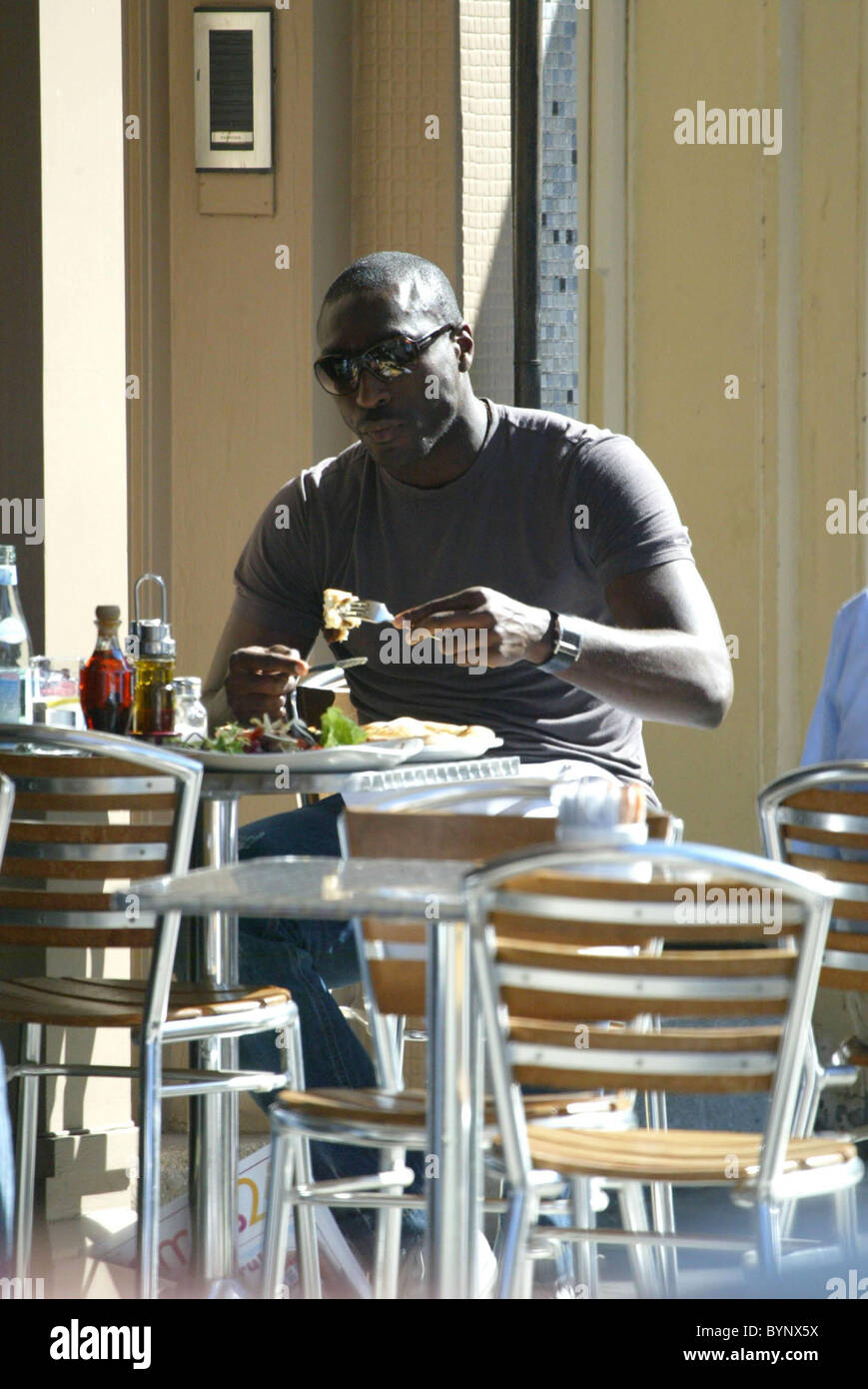 Sol Campbell enjoys a healthy salad in the sunshine in Primrose Hill ...