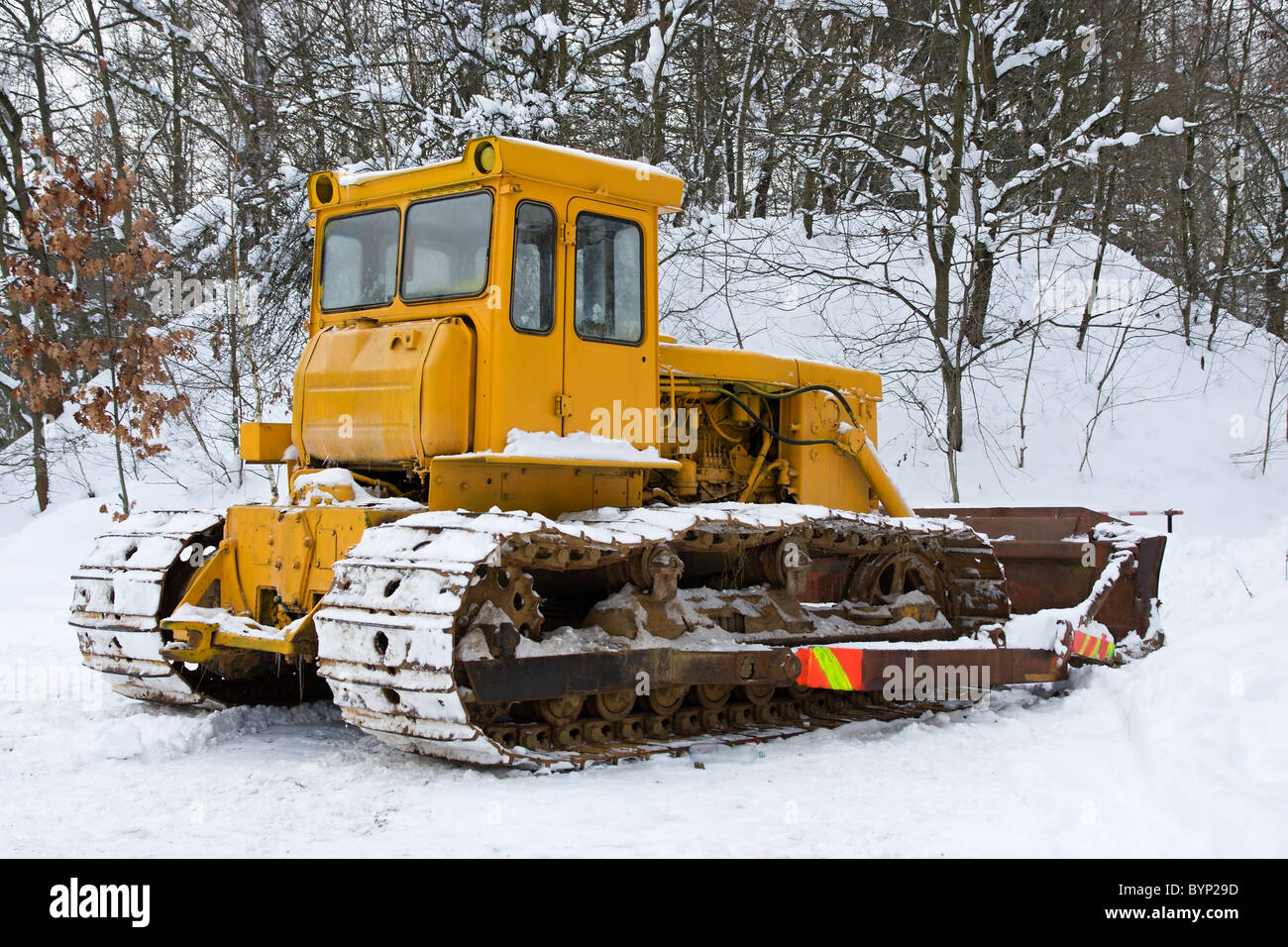 Bulldozer in the snow in winter Stock Photo - Alamy
