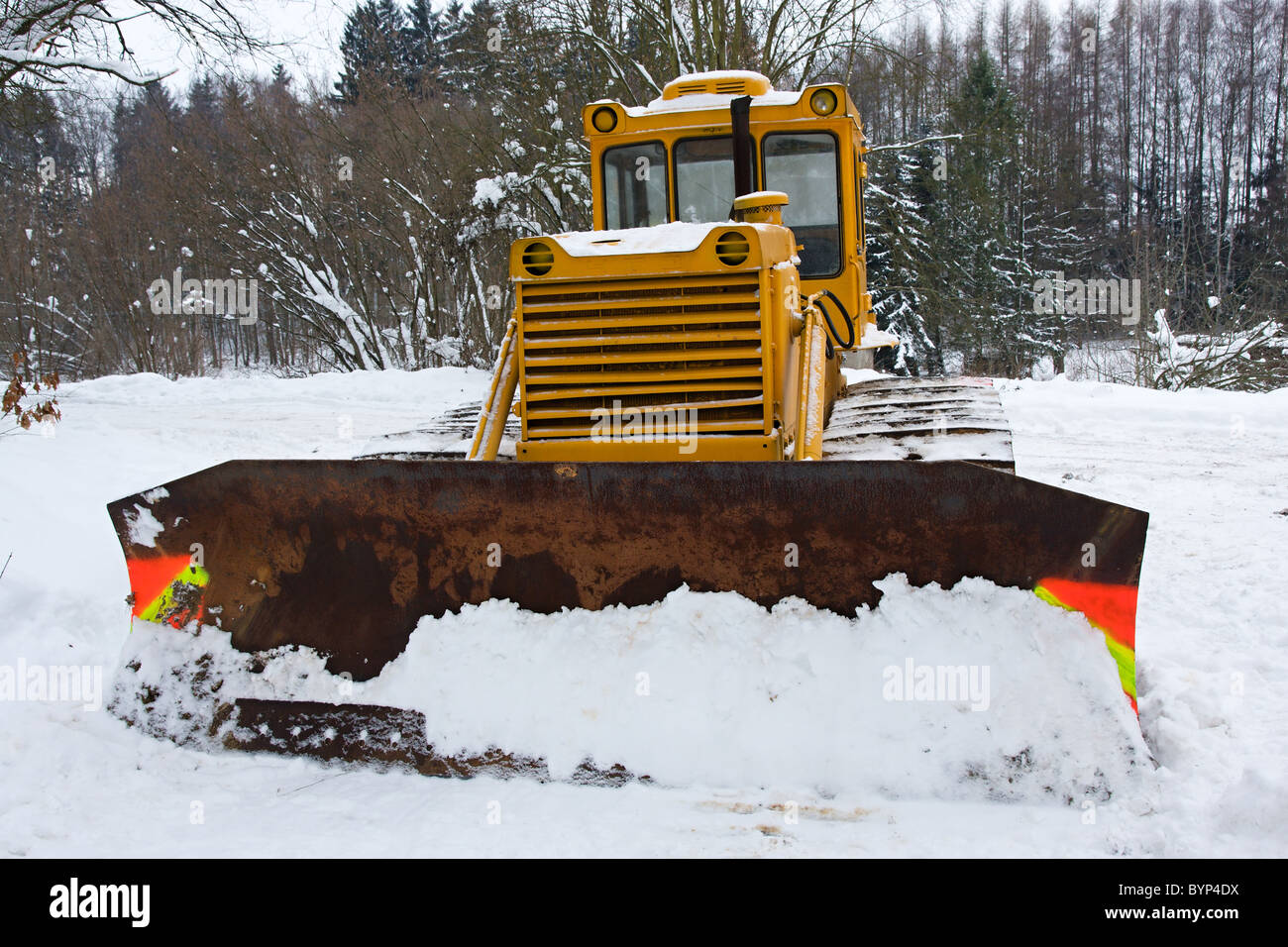 Bulldozer in the snow in winter Stock Photo - Alamy