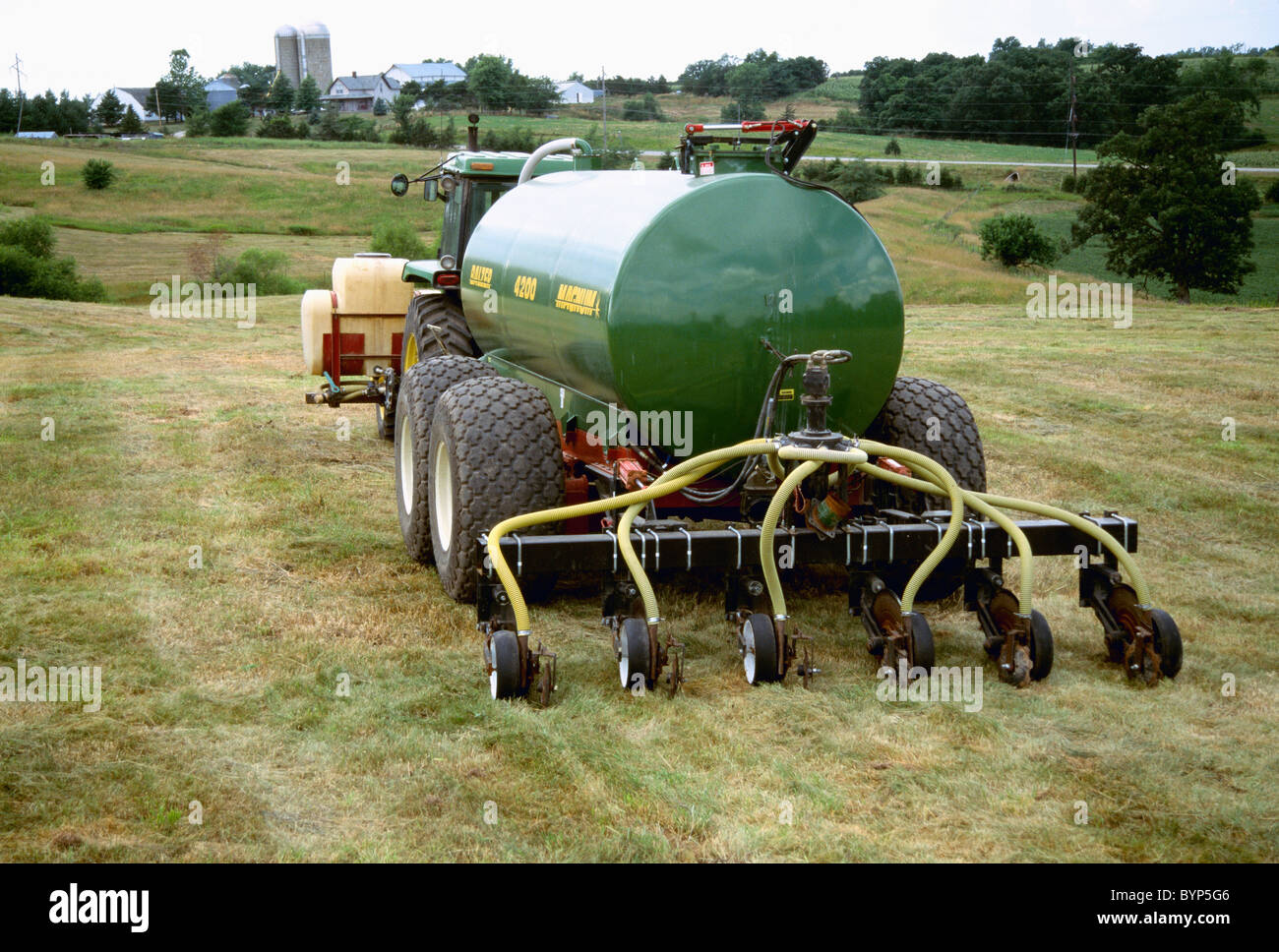 Agriculture - Chemical application, injecting liquid hog manure into ...