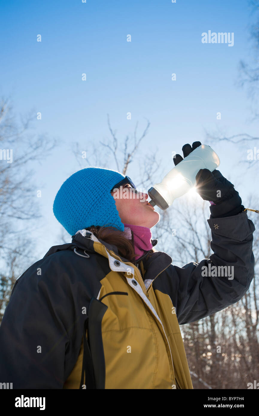 Woman cross country skier drinking water hi-res stock photography and ...