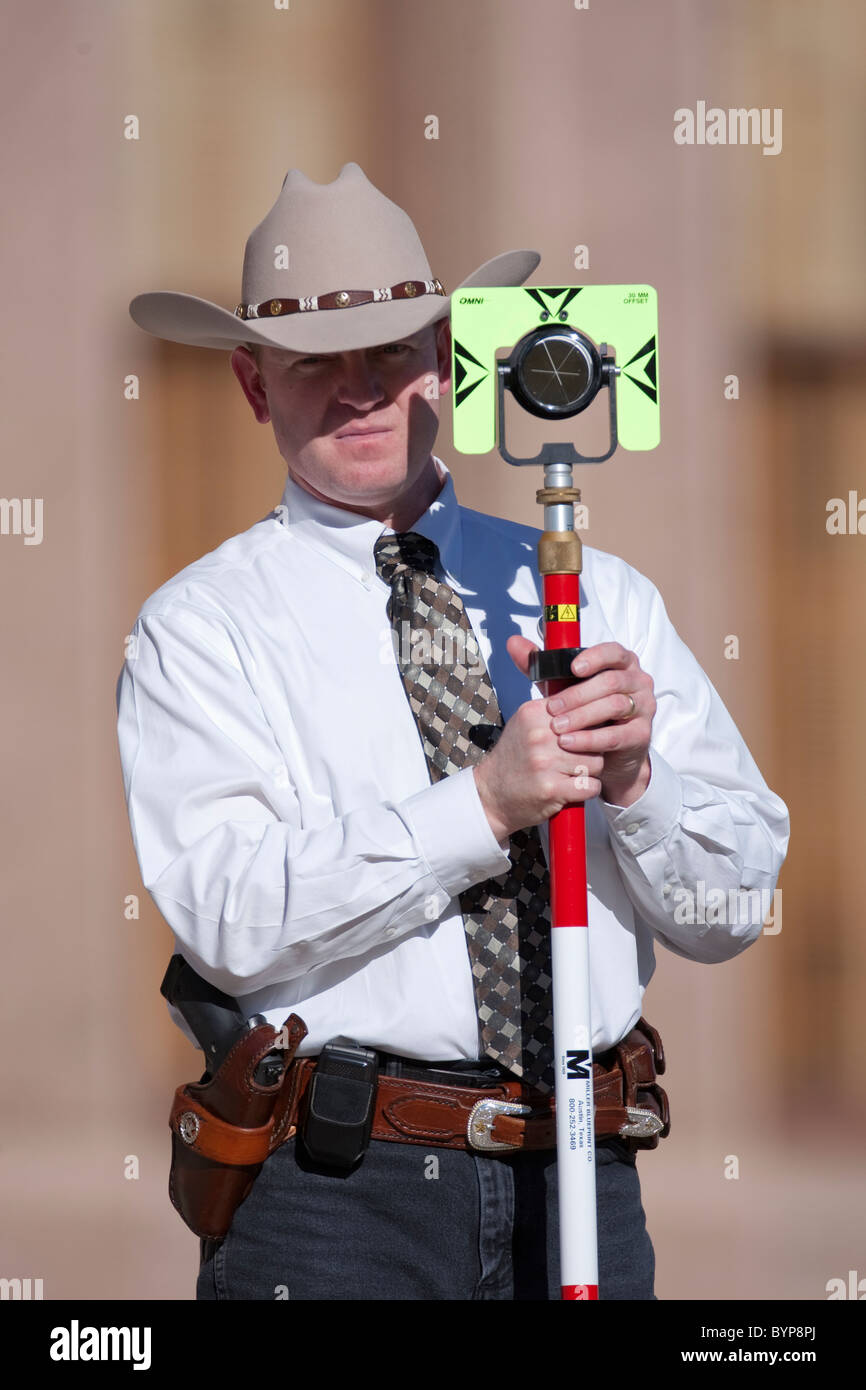 Texas Ranger holds GPS survey marking equipment to gather evidence at ...