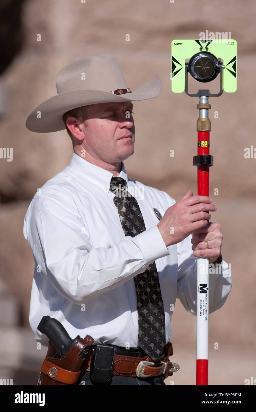 Texas Ranger holds GPS survey marking equipment to gather evidence at ...