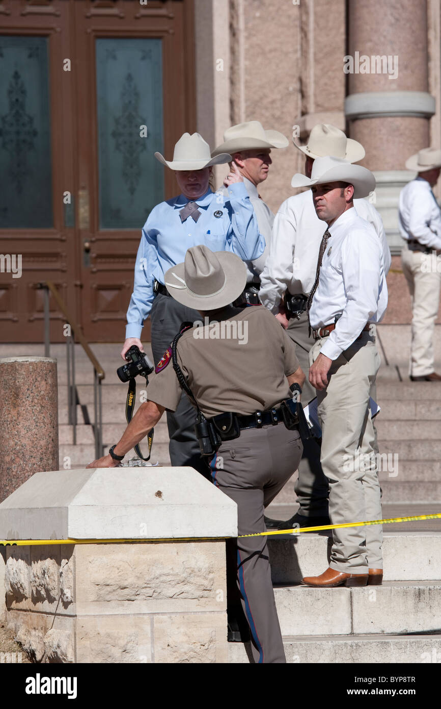 Texas Rangers gather evidence on the south steps of the Texas Capitol ...