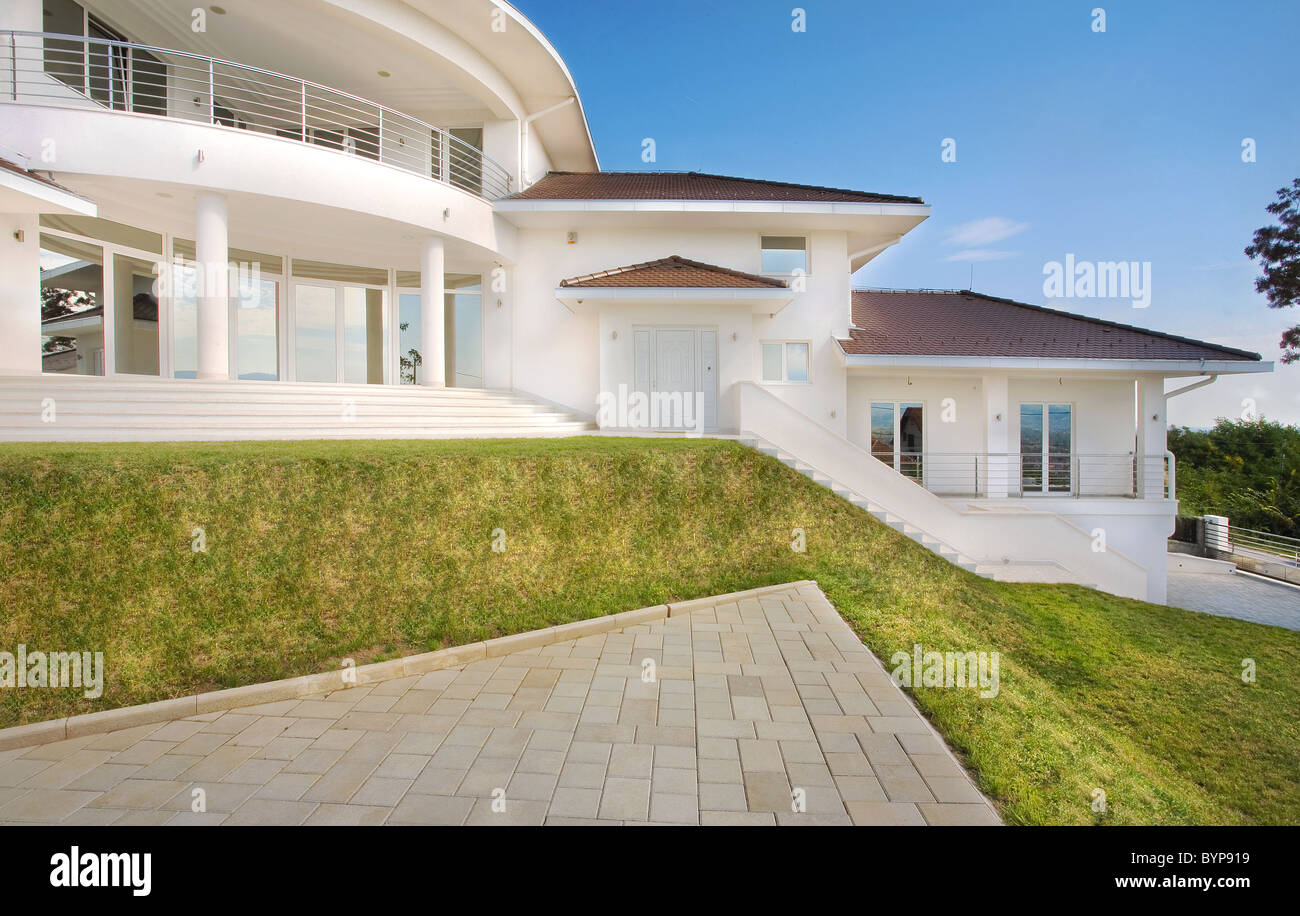 Modern house exteriors during day and night Stock Photo - Alamy