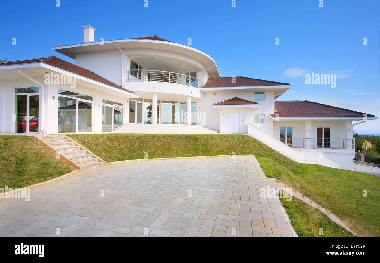 Modern house exteriors during day and night Stock Photo - Alamy