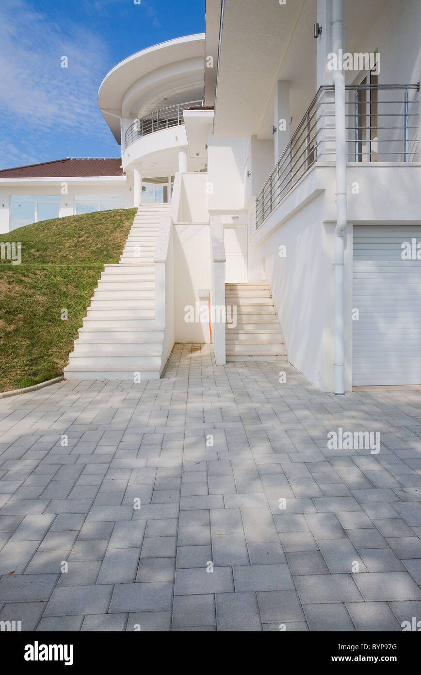 Modern house exteriors during day and night Stock Photo - Alamy