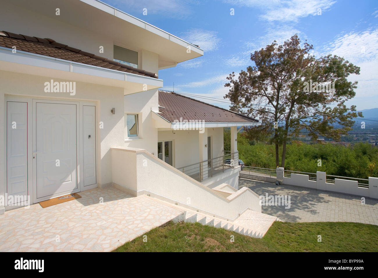Modern house exteriors during day and night Stock Photo - Alamy