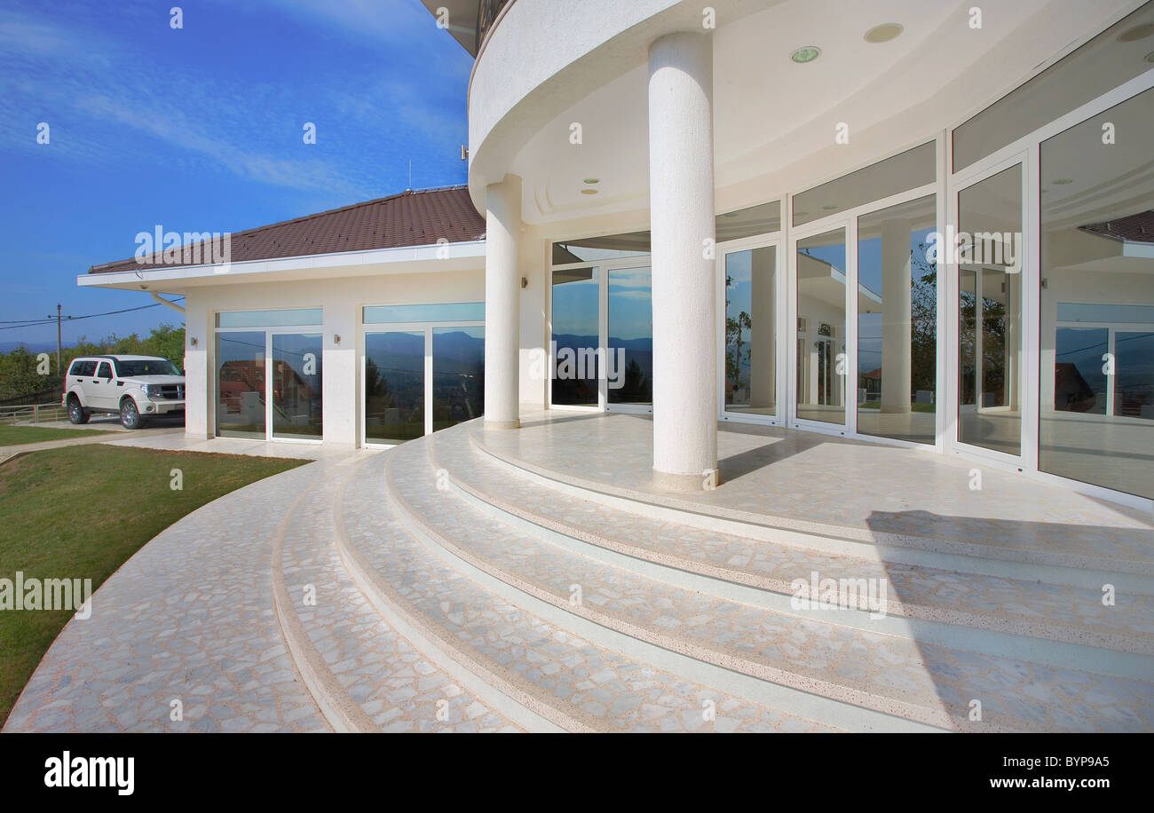 Modern house exteriors during day and night Stock Photo - Alamy