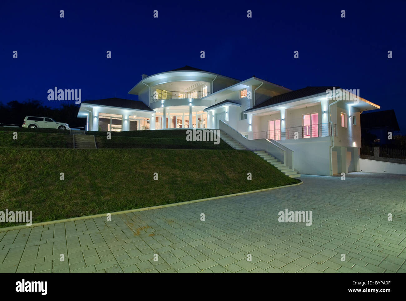Modern house exteriors during day and night Stock Photo - Alamy