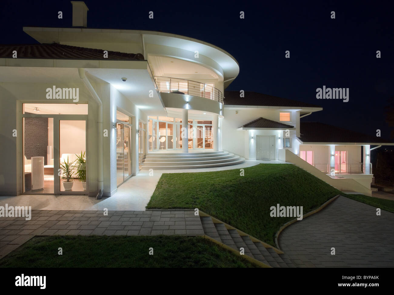 Modern house exteriors during day and night Stock Photo - Alamy
