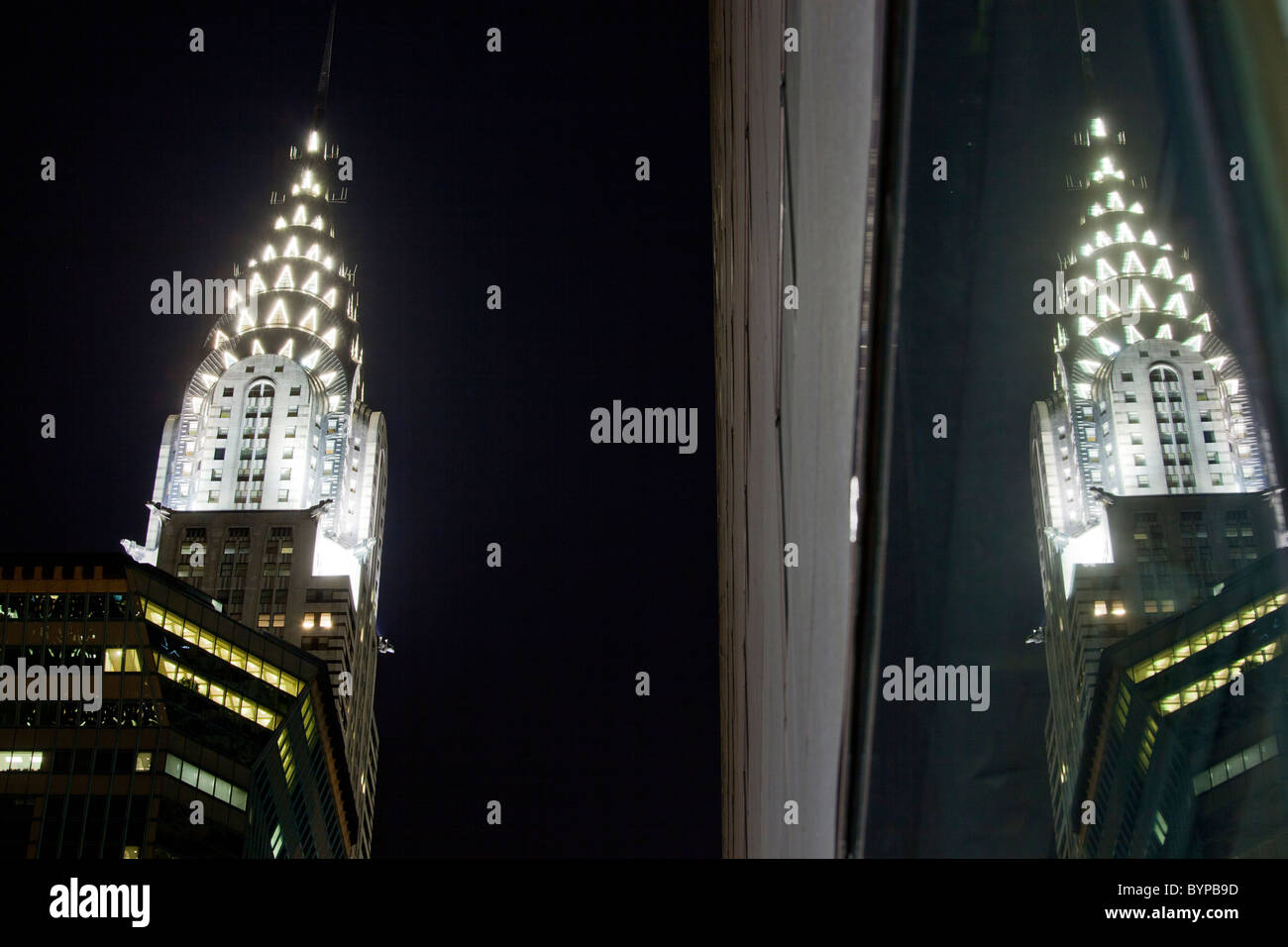 USA, New York, New York City, Chrysler Building is reflected in glass ...