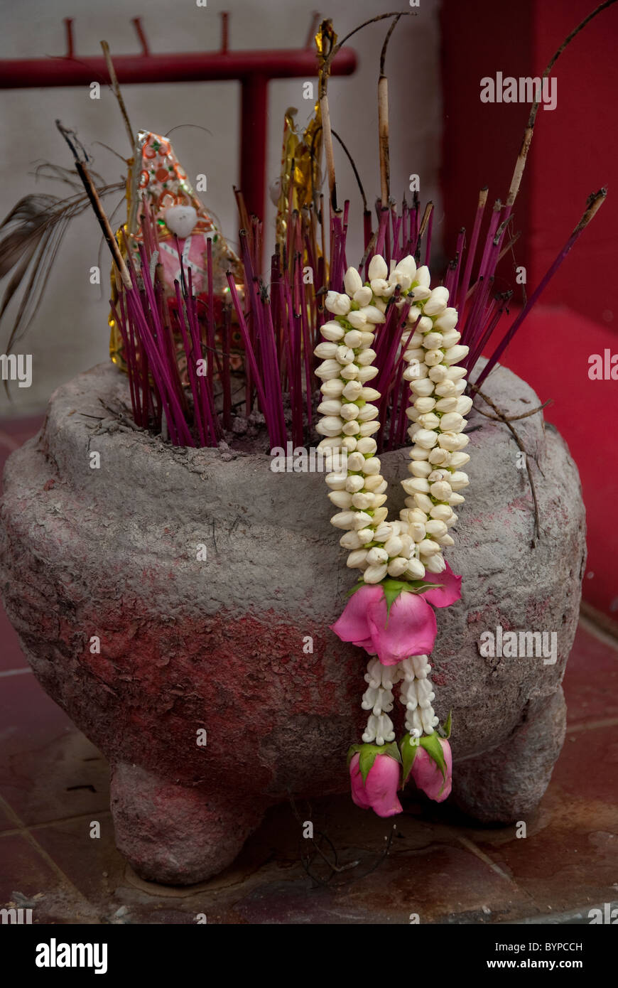 Flower garland on Bangkok shrine Stock Photo - Alamy