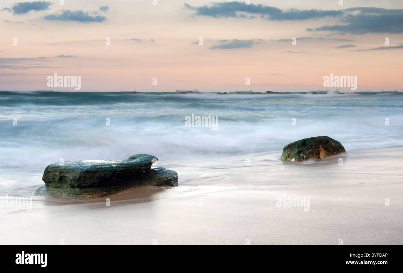 Sunset rocks water waves hi-res stock photography and images - Alamy