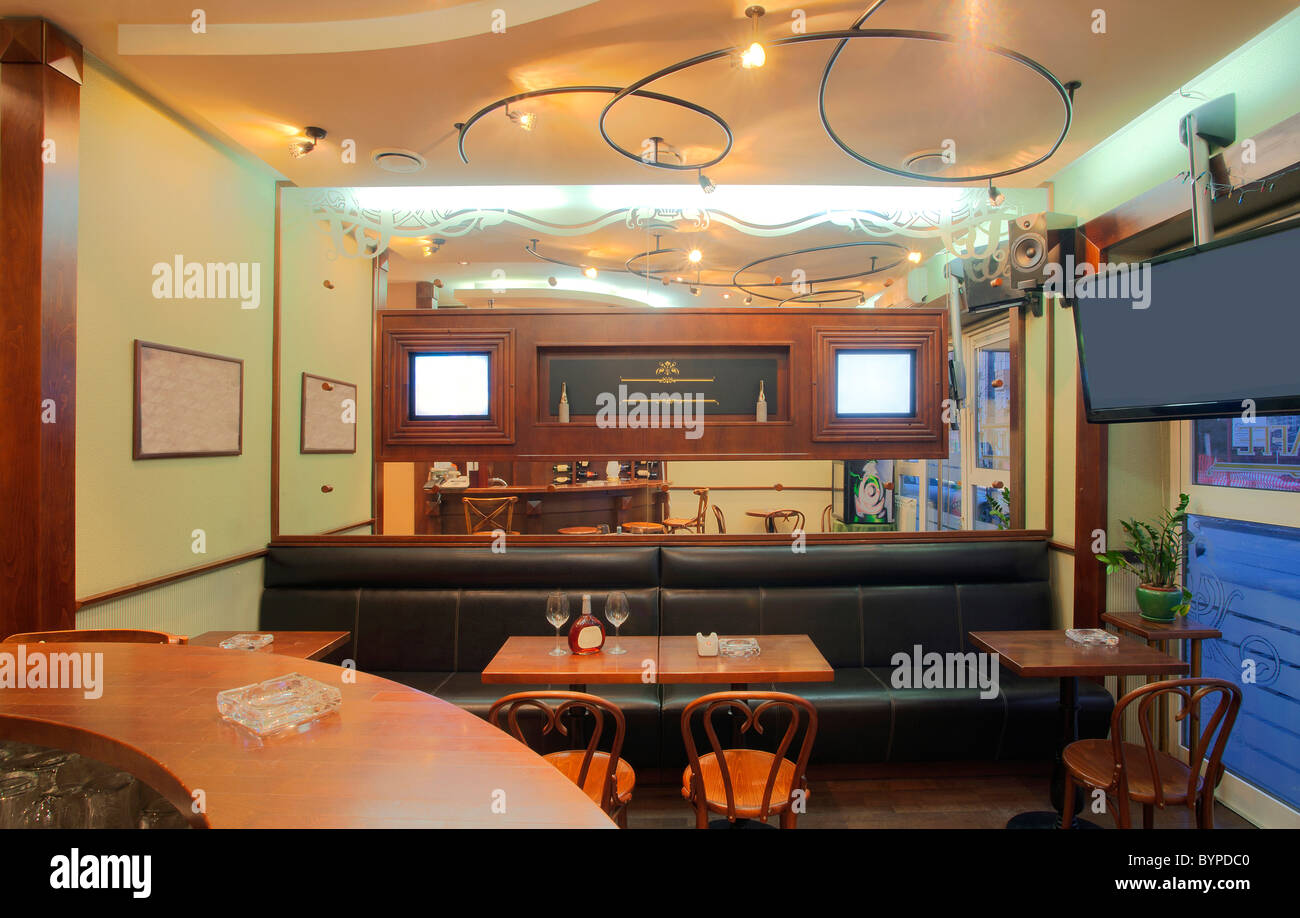 Interior of a small cafe, old fashioned style mixed with modern media ...