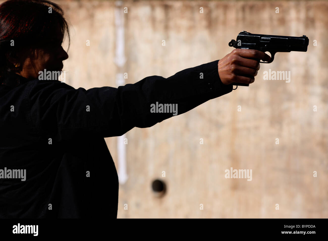 Shooting practice gun aim precision woman hi-res stock photography and ...