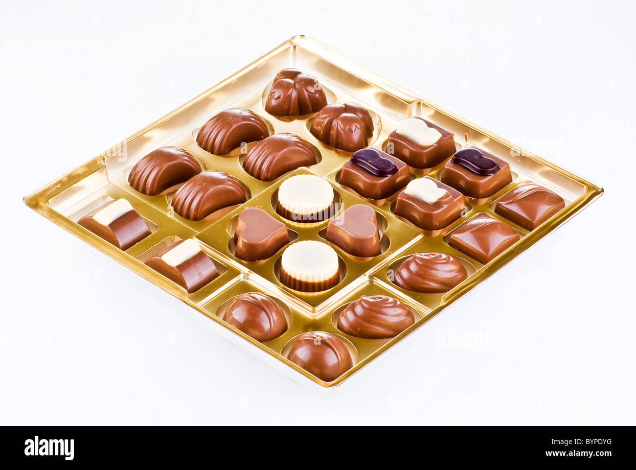 Assorted chocolates in the gold tray Stock Photo - Alamy