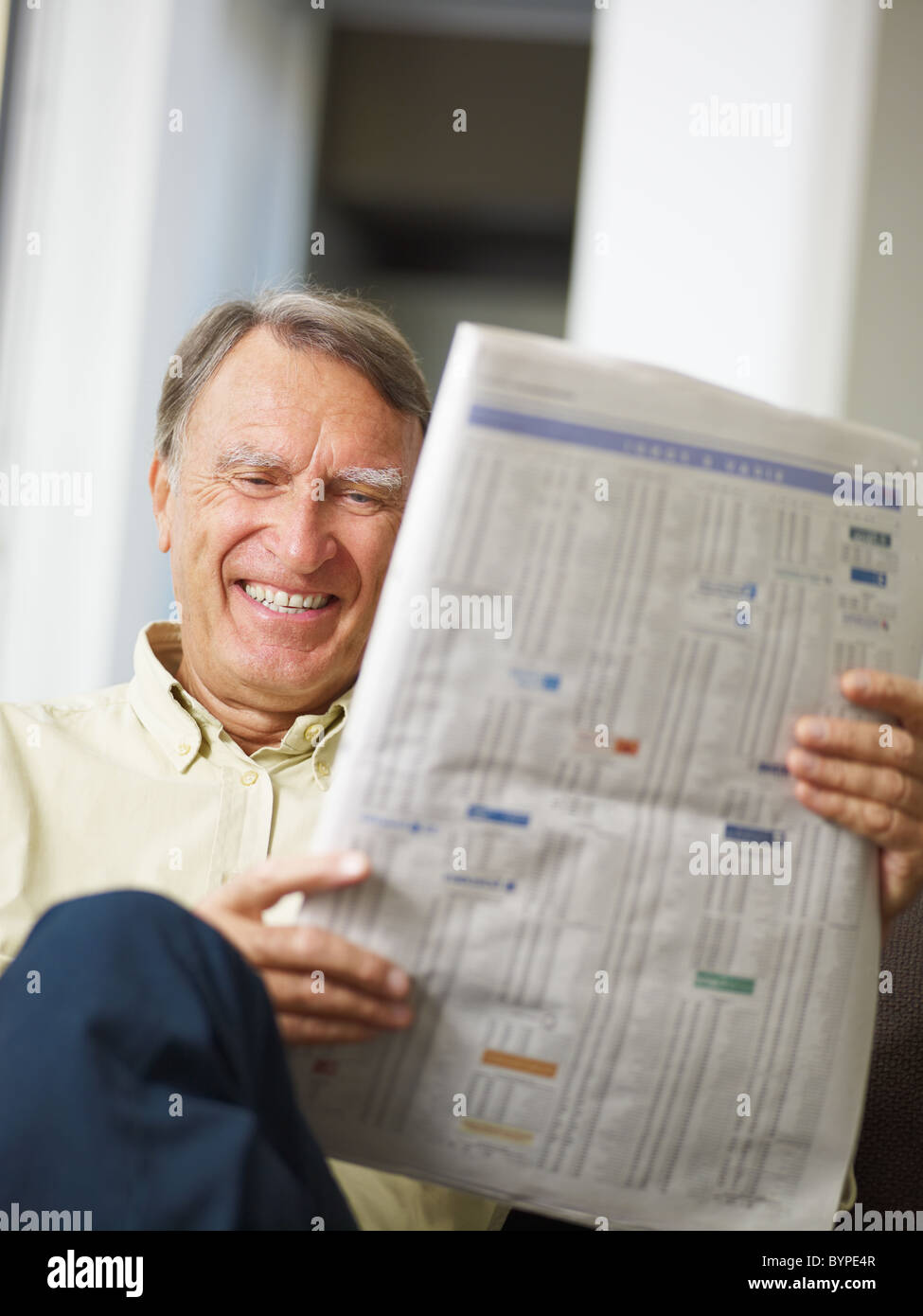 Senior man reading stock listings and smiling Stock Photo - Alamy Senior man reading stock listings and smiling Stock Photo - Alamy