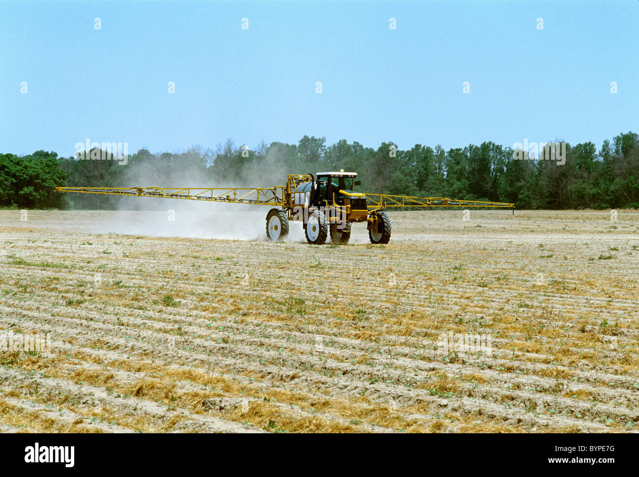 A Rogator high clearance sprayer applying insecticide on no-till ...