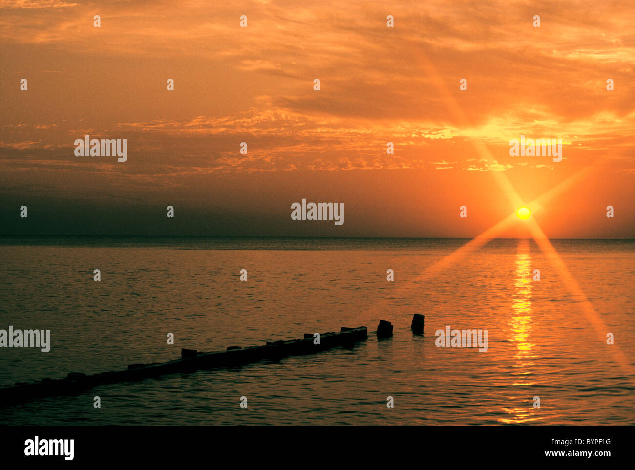 Sun reflected on water Stock Photo - Alamy