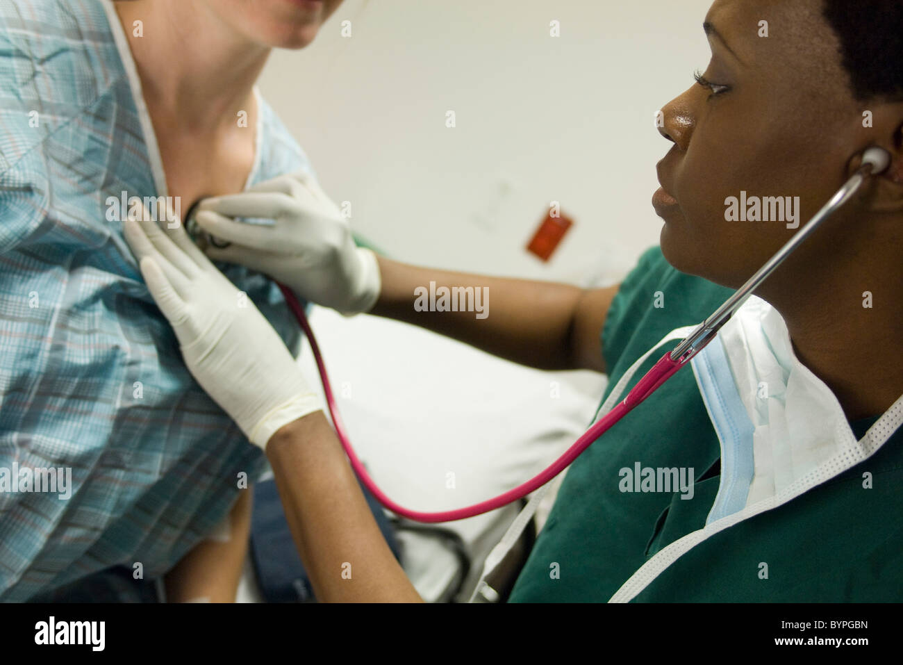 Doctor listening to patient's chest with stethoscope Stock Photo - Alamy