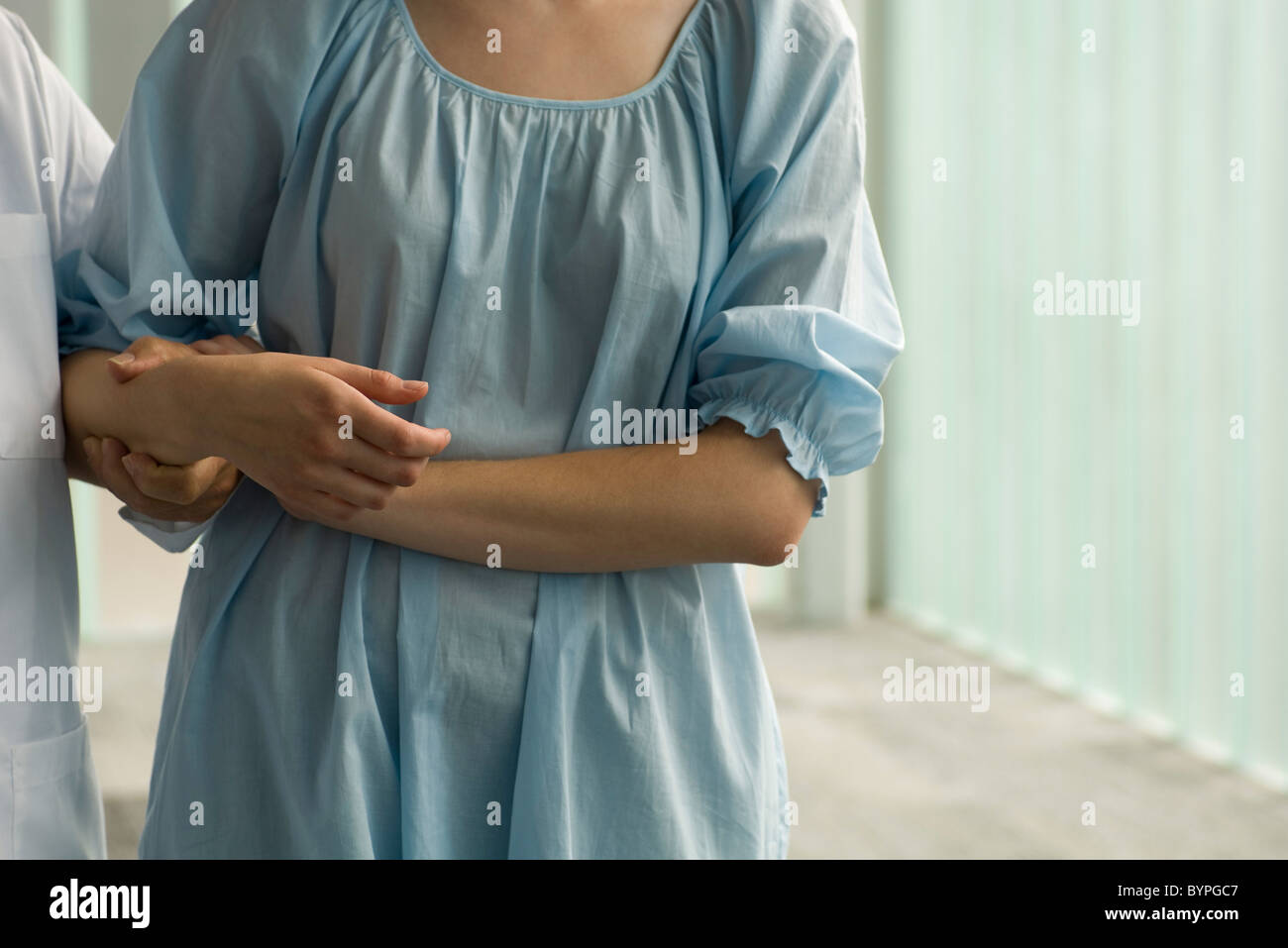 Two nurses helping patient hi-res stock photography and images - Alamy