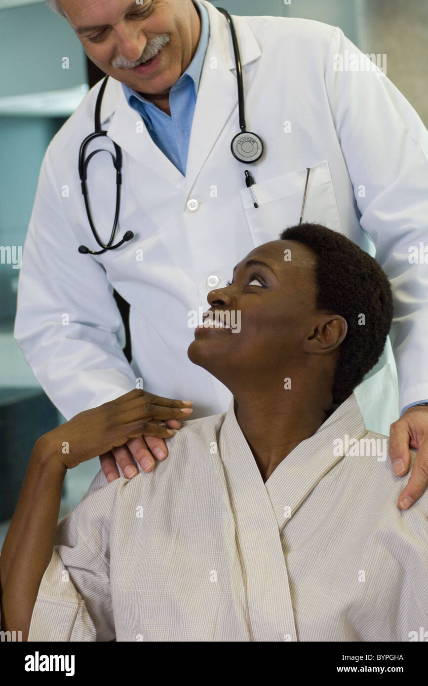 Doctor reassuring patient Stock Photo - Alamy
