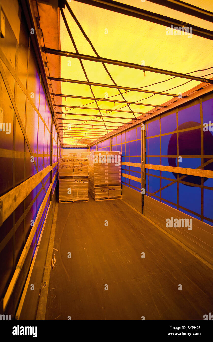 Wrapped pallets of cardboard boxes in trailer for delivery Stock Photo ...