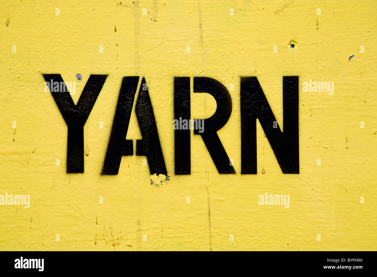 Stenciled lettering on sign reading "yarn Stock Photo - Alamy