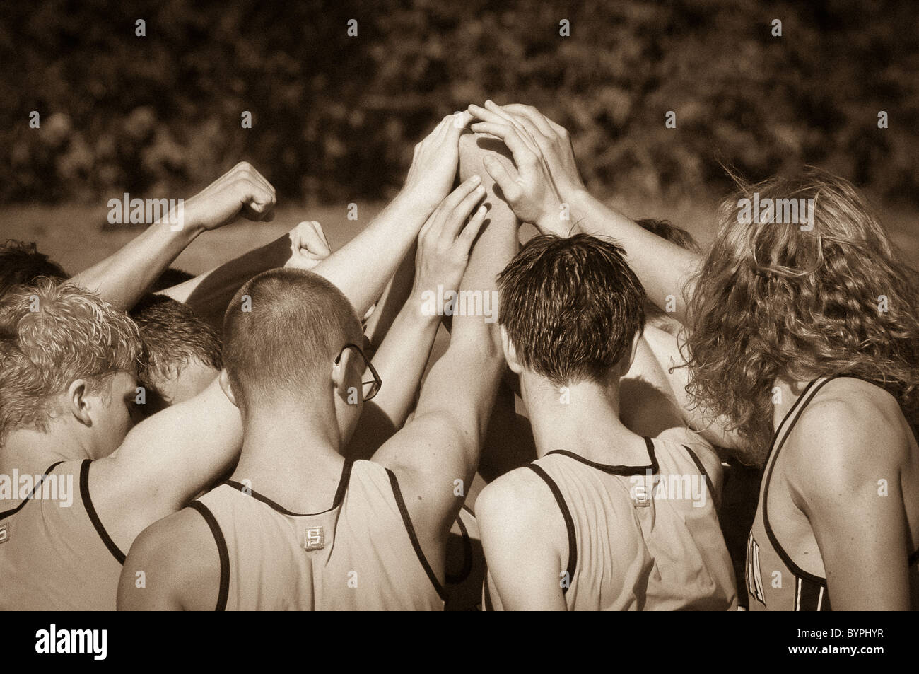 "Teamwork" - athletes pulling together as a team Stock Photo - Alamy