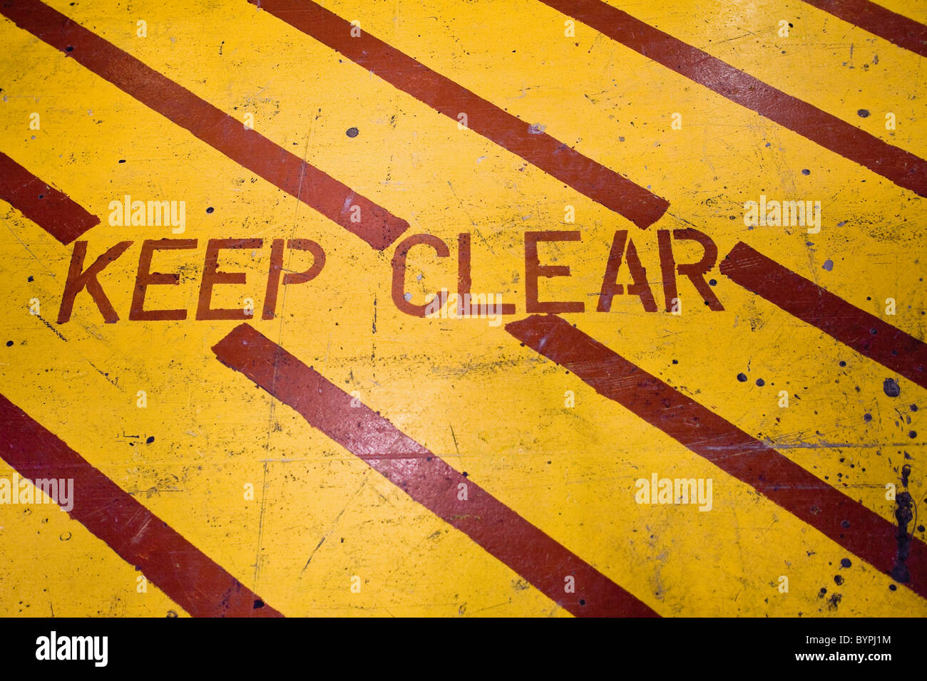 Keep clear warning stripes painted on floor Stock Photo - Alamy