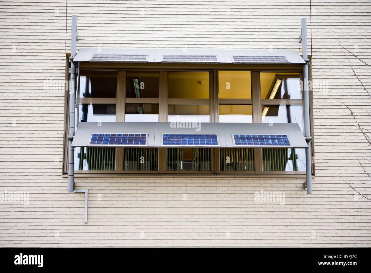 Solar panels mounted in front of window on building exterior Stock ...