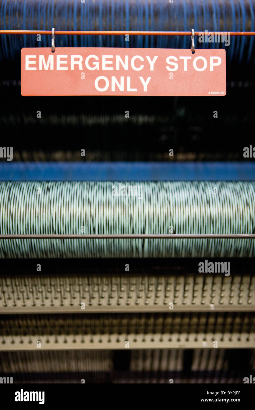Emergency stop on weaving machine in carpet tile factory Stock Photo ...